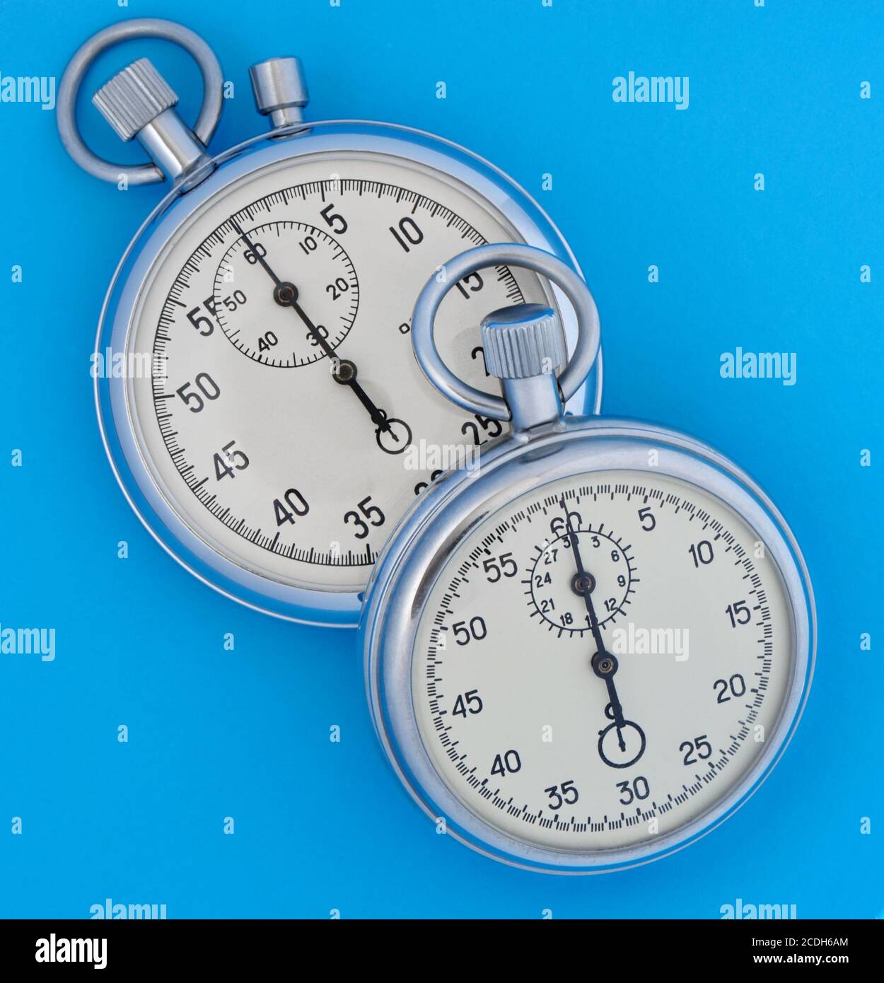Two stopwatch on blue Stock Photo - Alamy