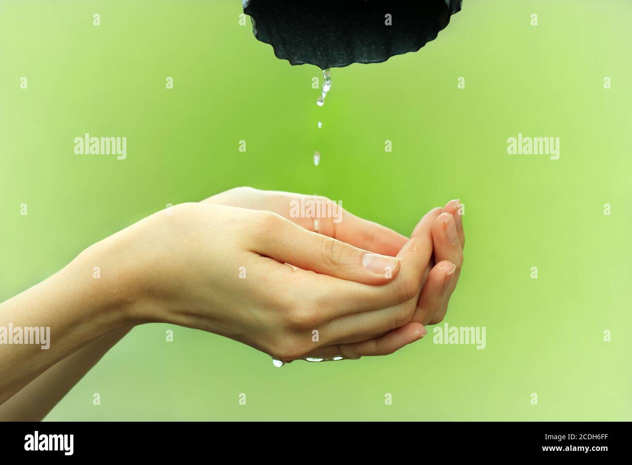 Hands catching clean falling water hi-res stock photography and images ...