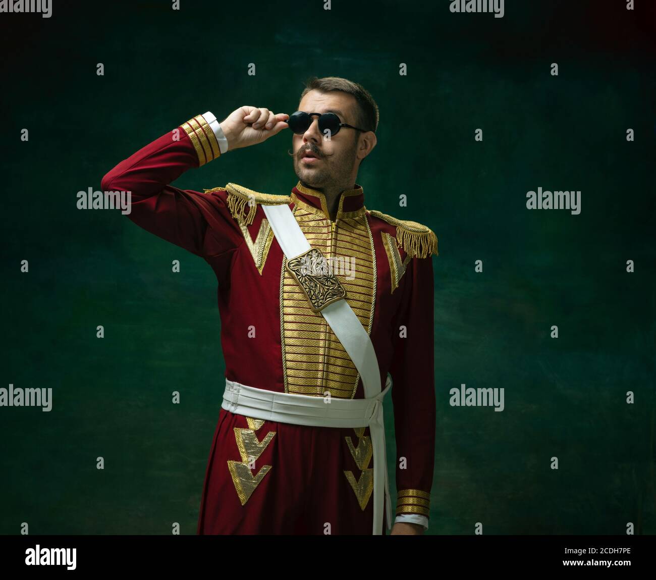 Wearing stylish eyewear. Young man in suit as Nicholas II isolated on ...