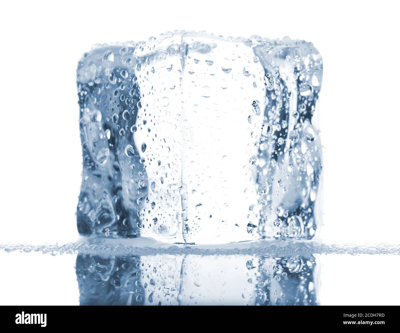 Single ice cube with water drops Stock Photo - Alamy