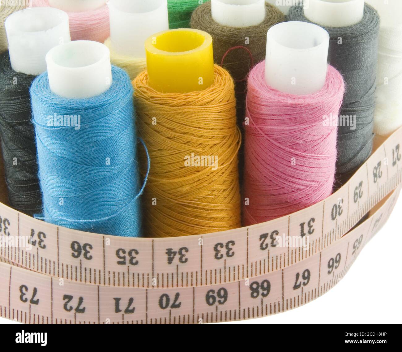 Many colorful threads with centimeters over background Stock Photo - Alamy