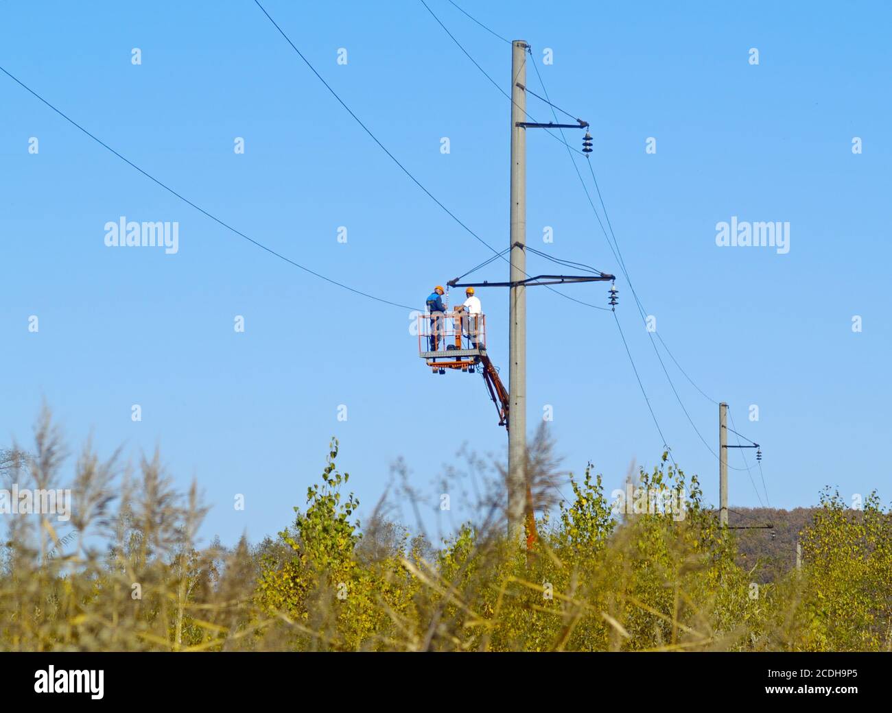 Repair of a high-voltage electric main Stock Photo - Alamy