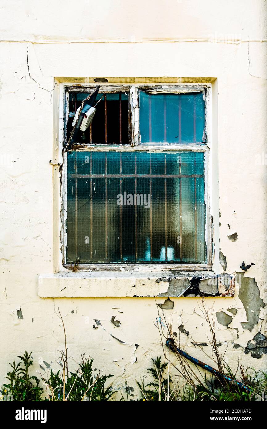 Broken window of an old abandoned building near Consett, County Durham ...