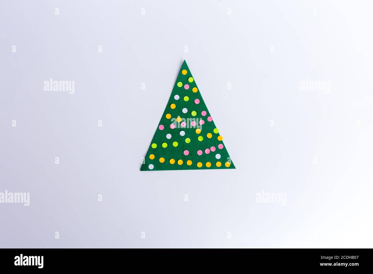 creative triangle christmas tree in with color dots from paper, top ...