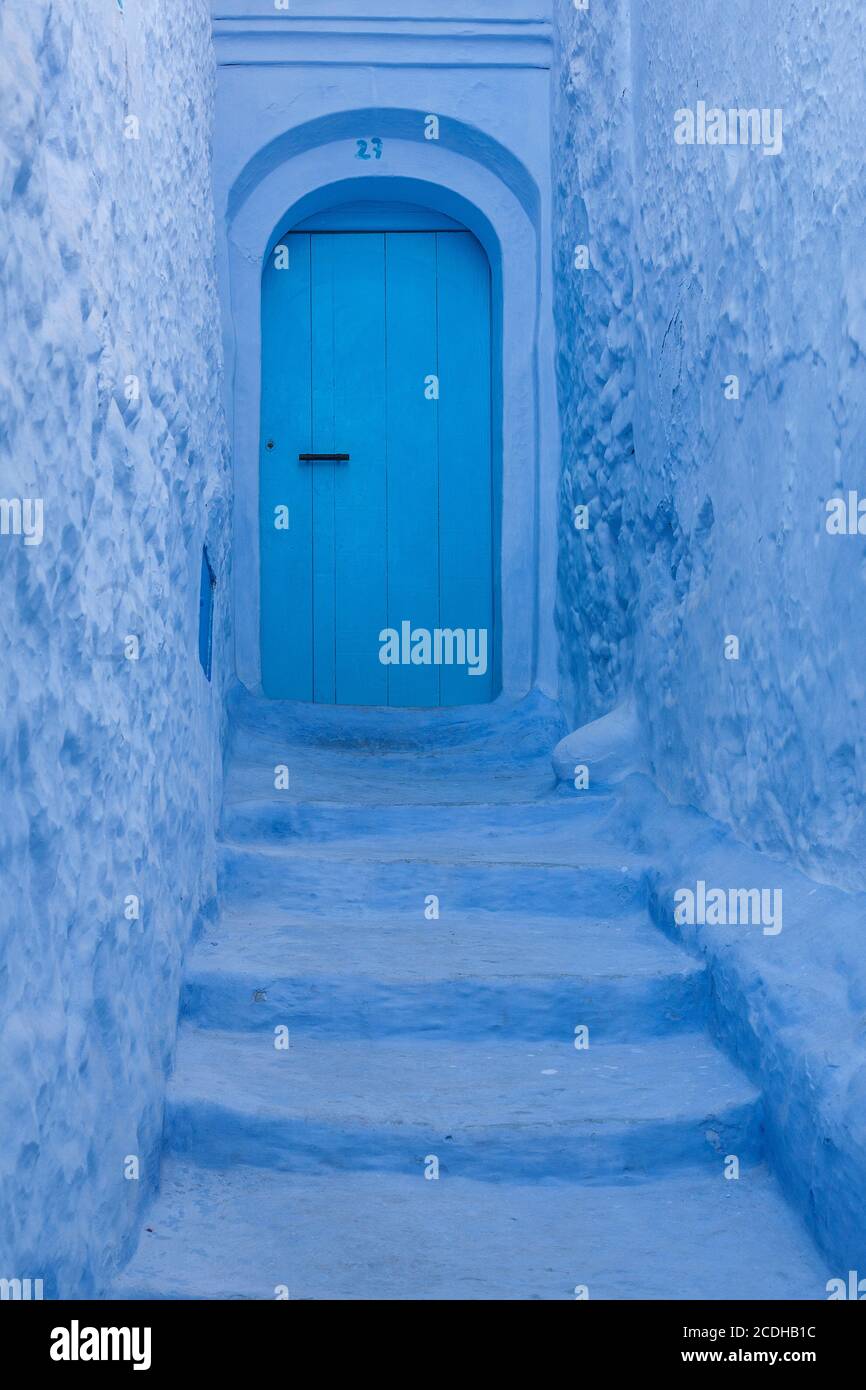 Steps leading up to a door in the blue city of Chefchaouen, Morocco ...