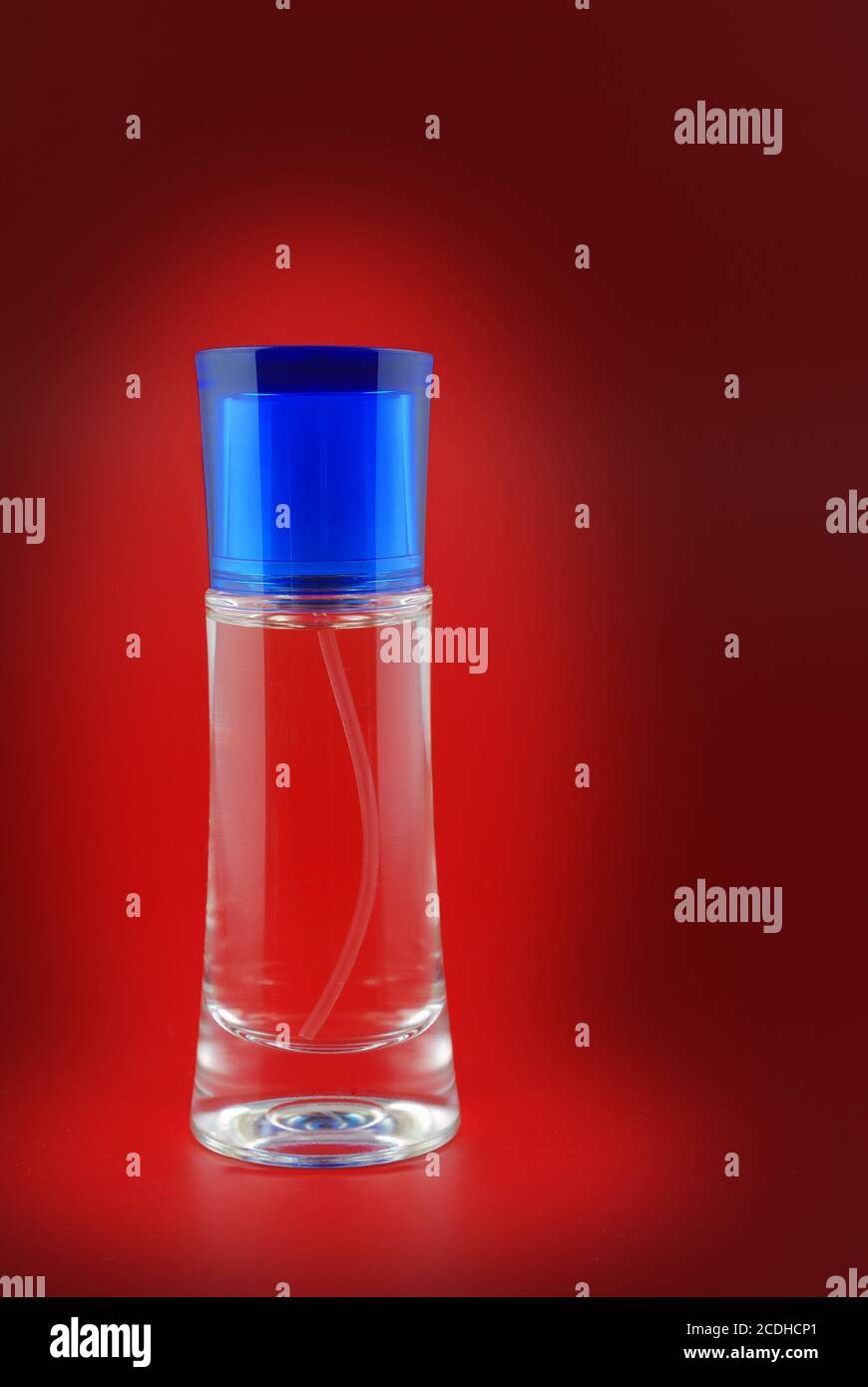 bottle perfume in light Stock Photo - Alamy