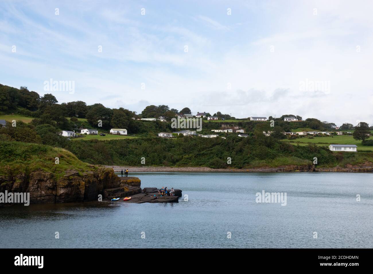 A family spending time at the coast in Red Wharf Bay, Anglesey, Wales ...
