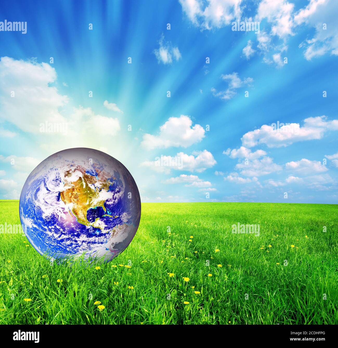 Earth globe on green grass conceptual Stock Photo - Alamy