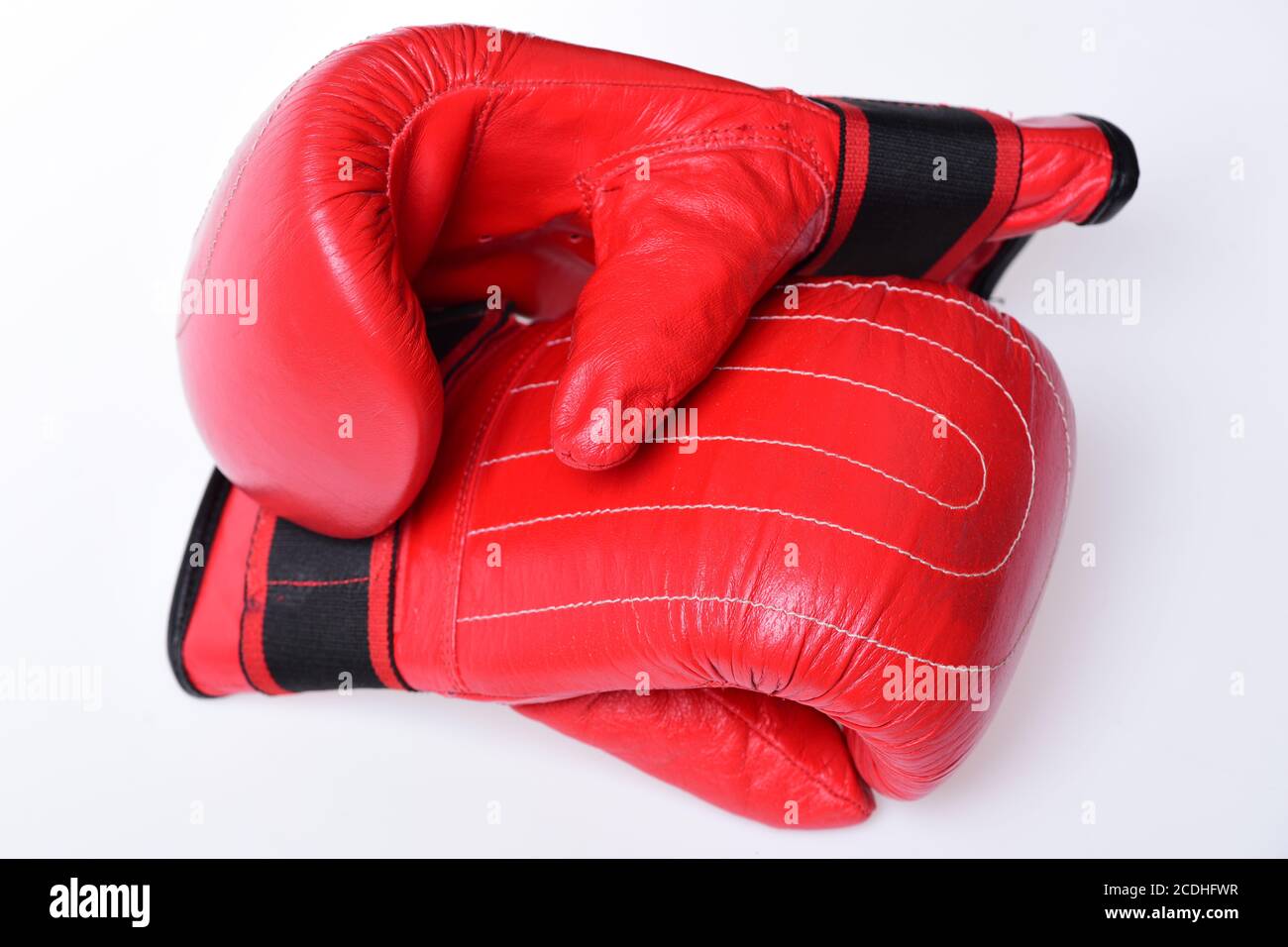 Pair of boxing gloves lying next to each other. Combat and fight ...