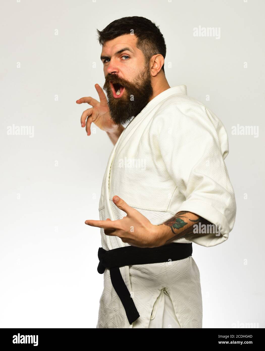 Japanese martial arts concept. Judo master with black belt practices ...