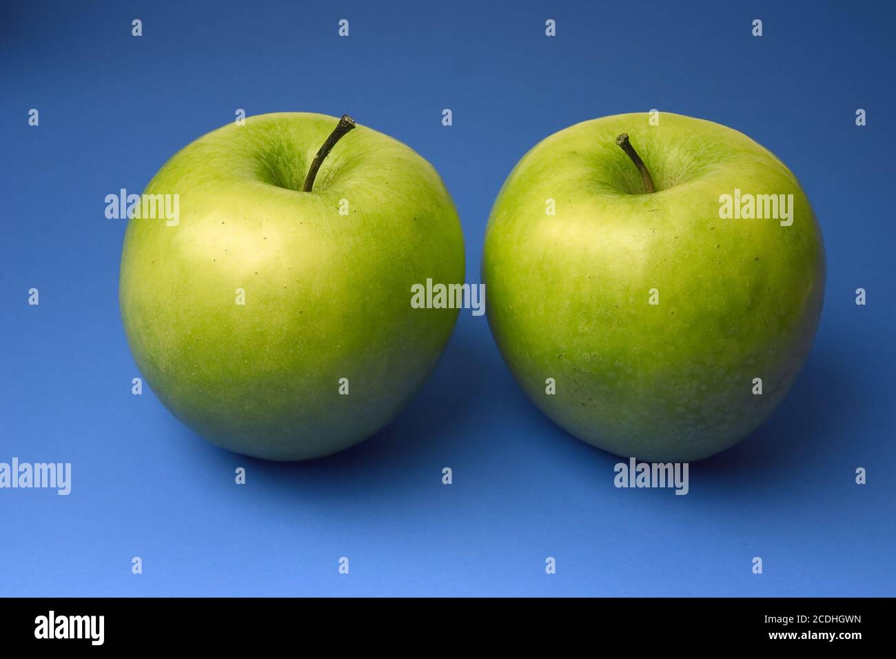 two appetizing apples of green color Stock Photo - Alamy