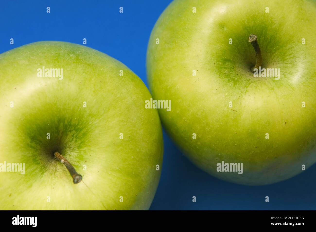 two appetizing apples of green color Stock Photo - Alamy