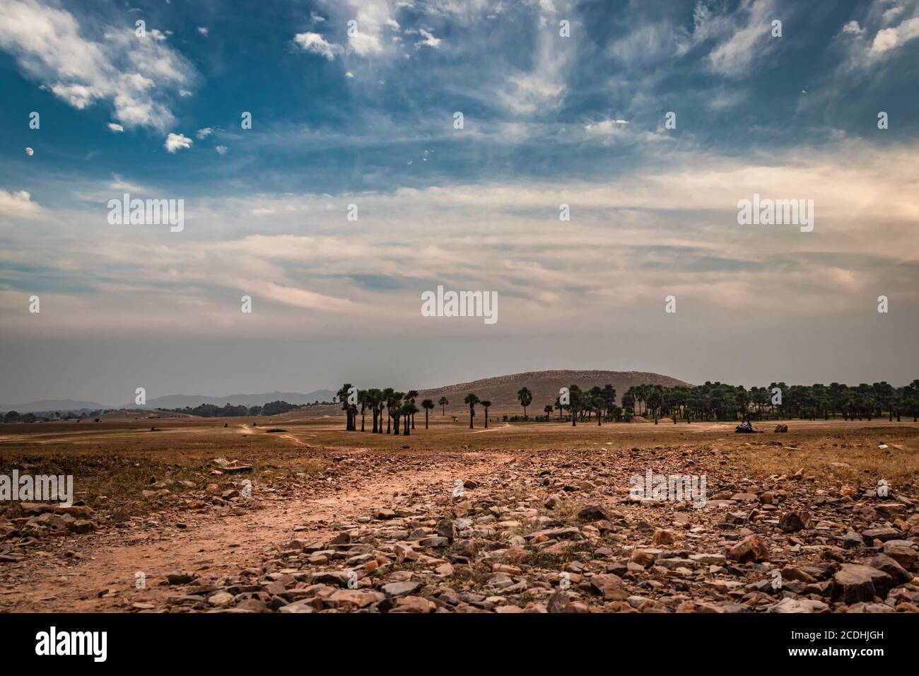 countryside empty rural road with mist and surrounded by mountains at ...