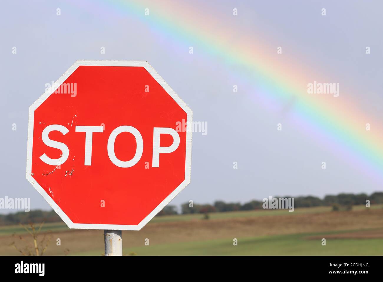 Rainbow with stop sign Stock Photo - Alamy