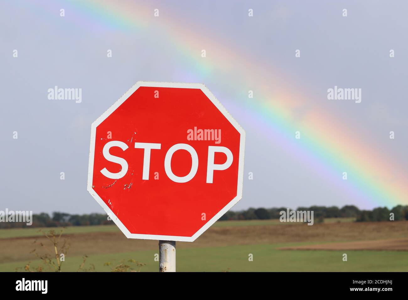 Rainbow with stop sign Stock Photo - Alamy
