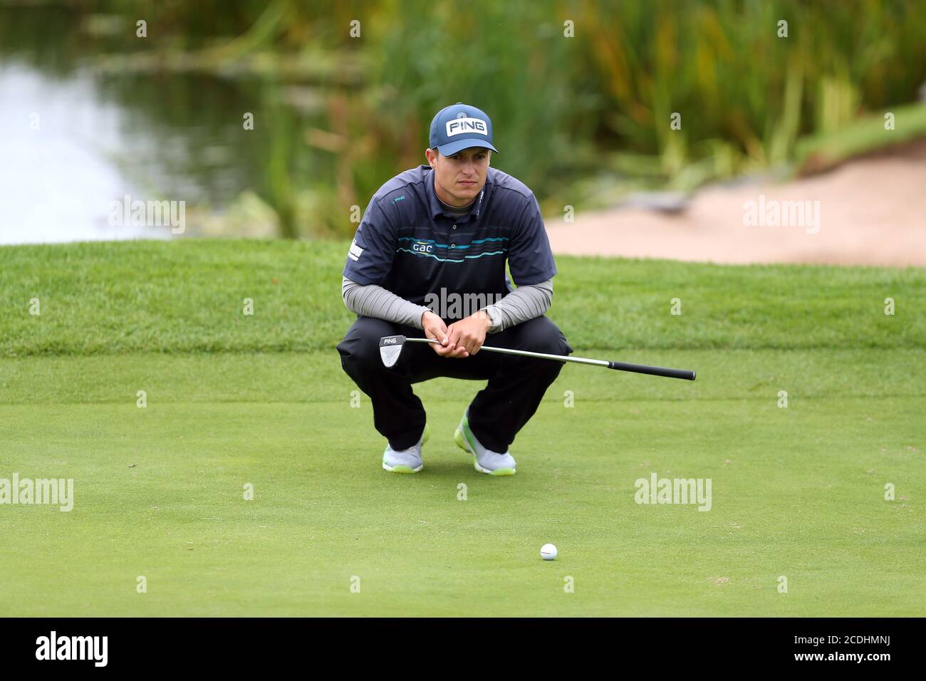 Scotland’s Calum Hill lines up a putt on the ninth hole during day two ...