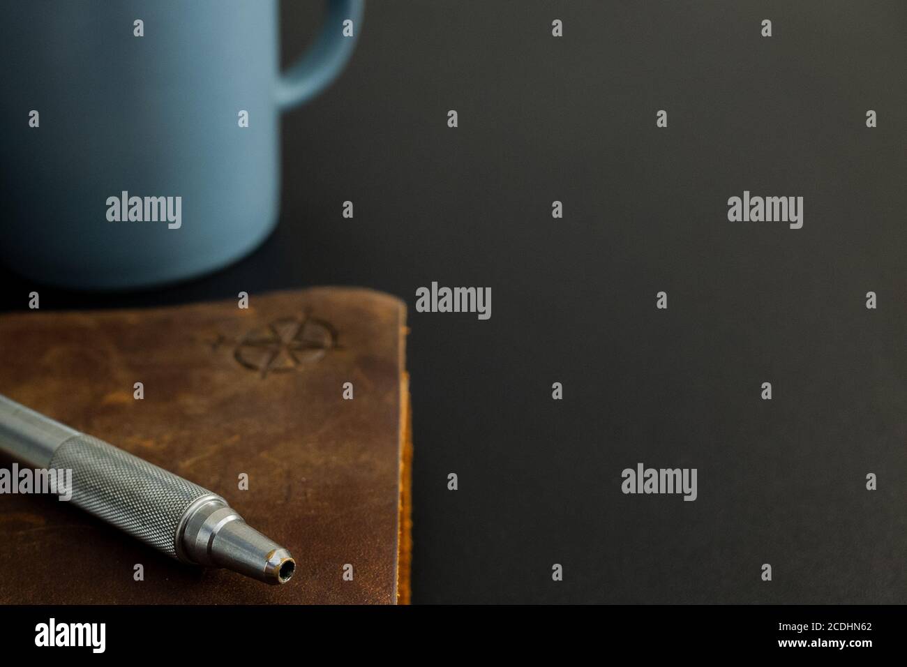 Coffee and Journal on a black background Stock Photo - Alamy