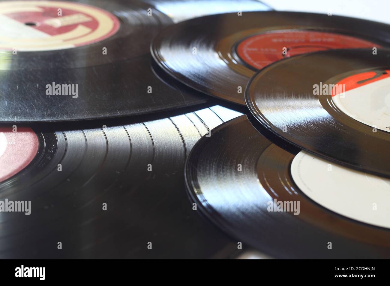 Background of vinyl records with red and white labels Stock Photo - Alamy