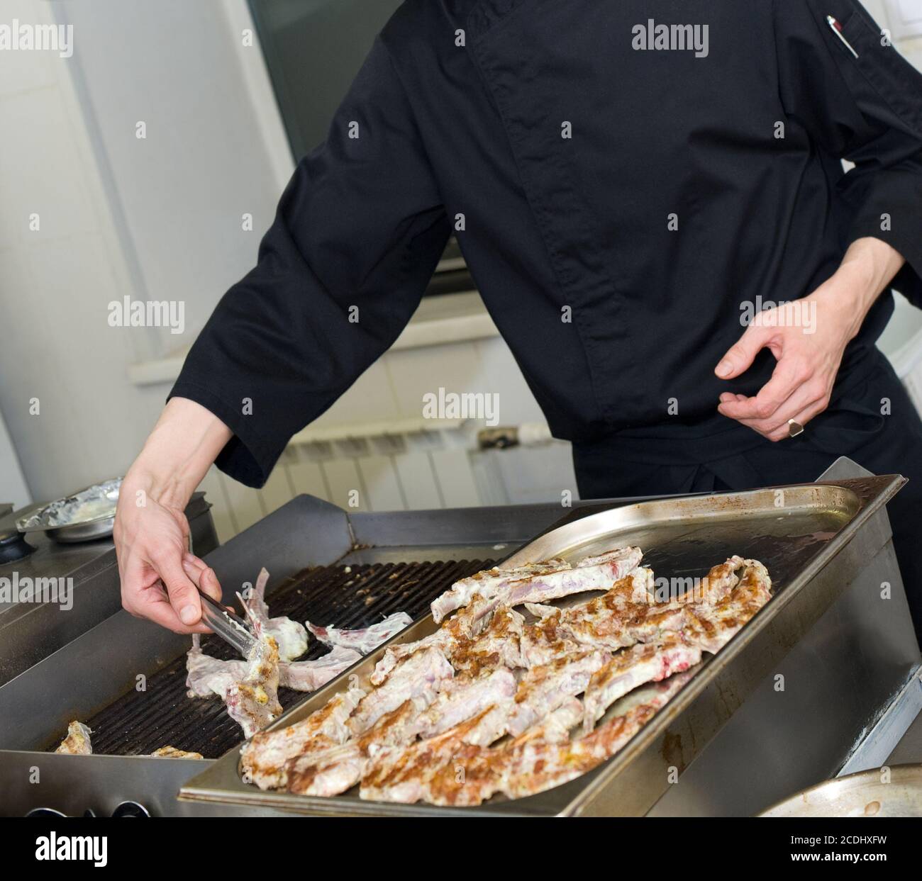 chef grills meat Stock Photo - Alamy