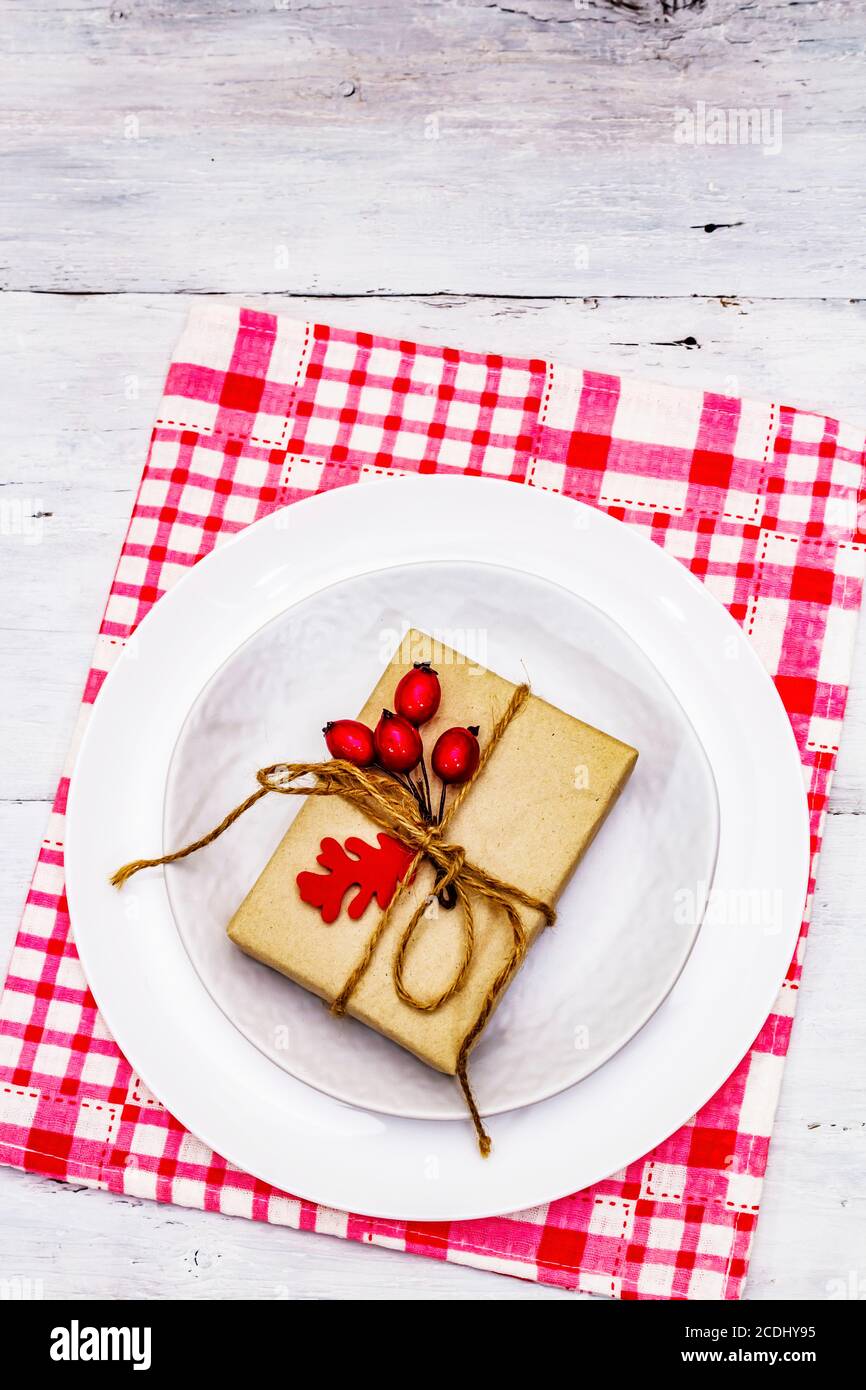 Zero waste dinner place setting. Ceramic plates, gift, linen napkin and ...