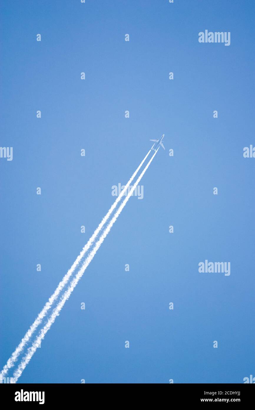 White airplane trace Stock Photo - Alamy