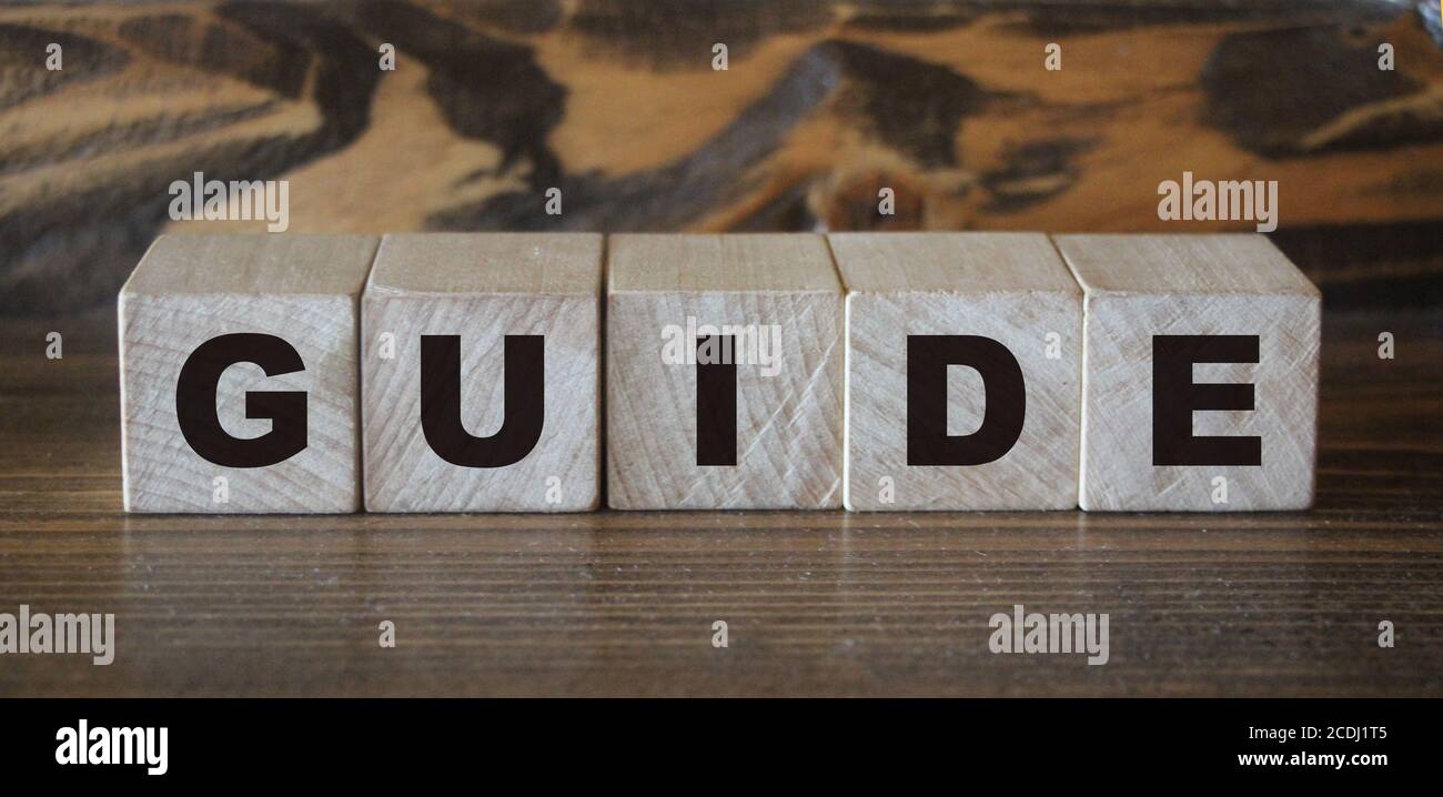 Guide Word Written In Wooden Cubes Stock Photo - Alamy