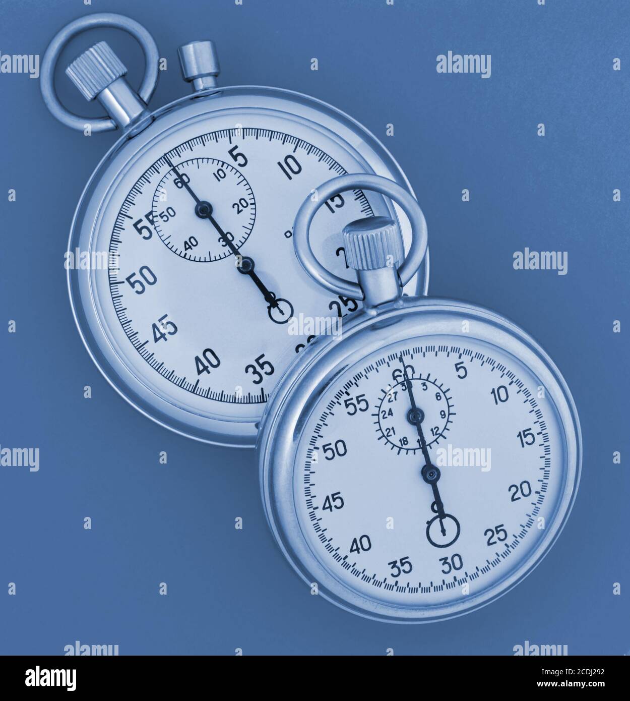 Two stopwatch blue toned Stock Photo - Alamy