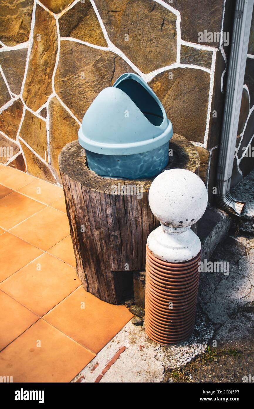 trash stuffed into a hollow log Stock Photo - Alamy