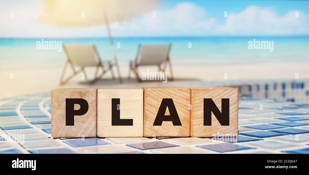 Plan word made with building blocks on relaxed beach background. Sun ...