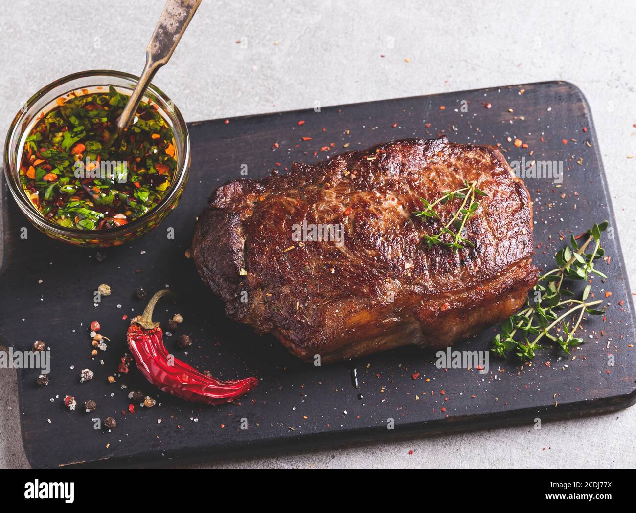 juicy beef steak, mutton roasted on a cutting board, view from above ...
