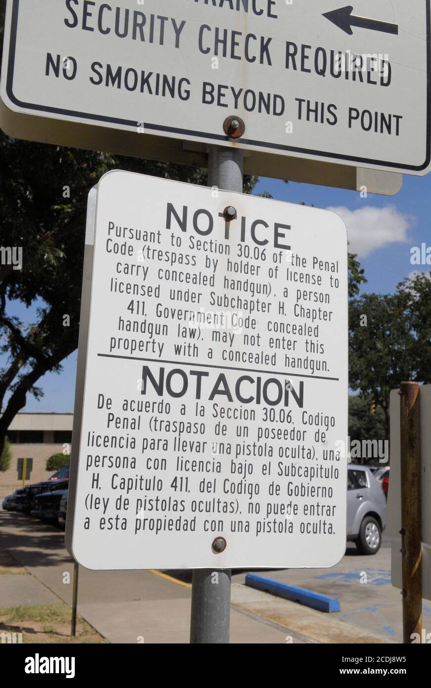 Wichita Falls, TX July 25, 2007: Bilingual security sign outside the ...