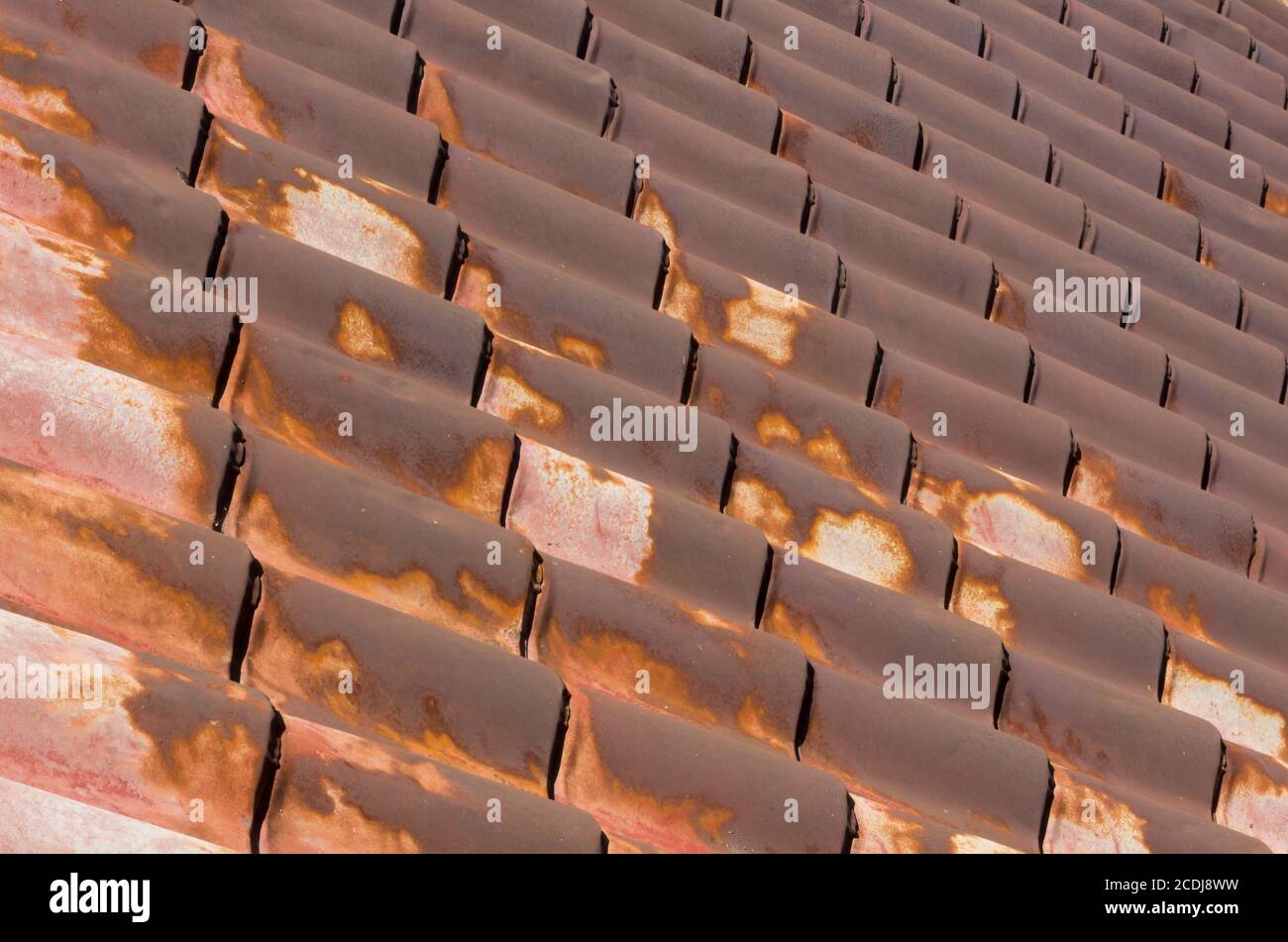 Worn and Rusty Roof Tiles in Diagonal Pattern Stock Photo - Alamy
