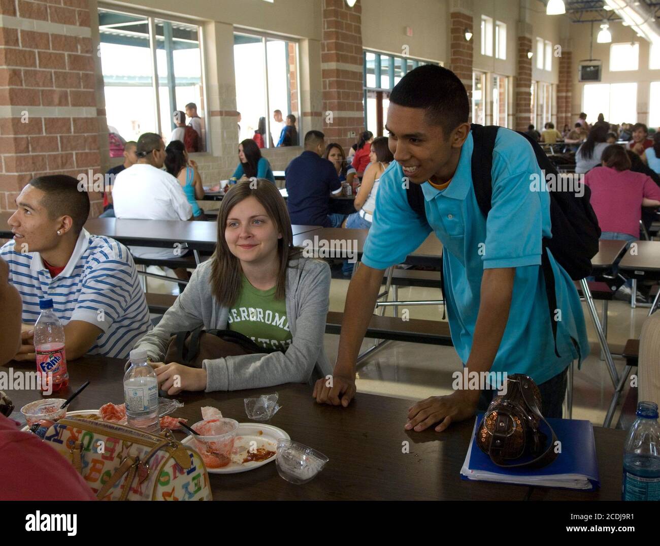 Diverse friends in school cafeteria hi-res stock photography and images ...