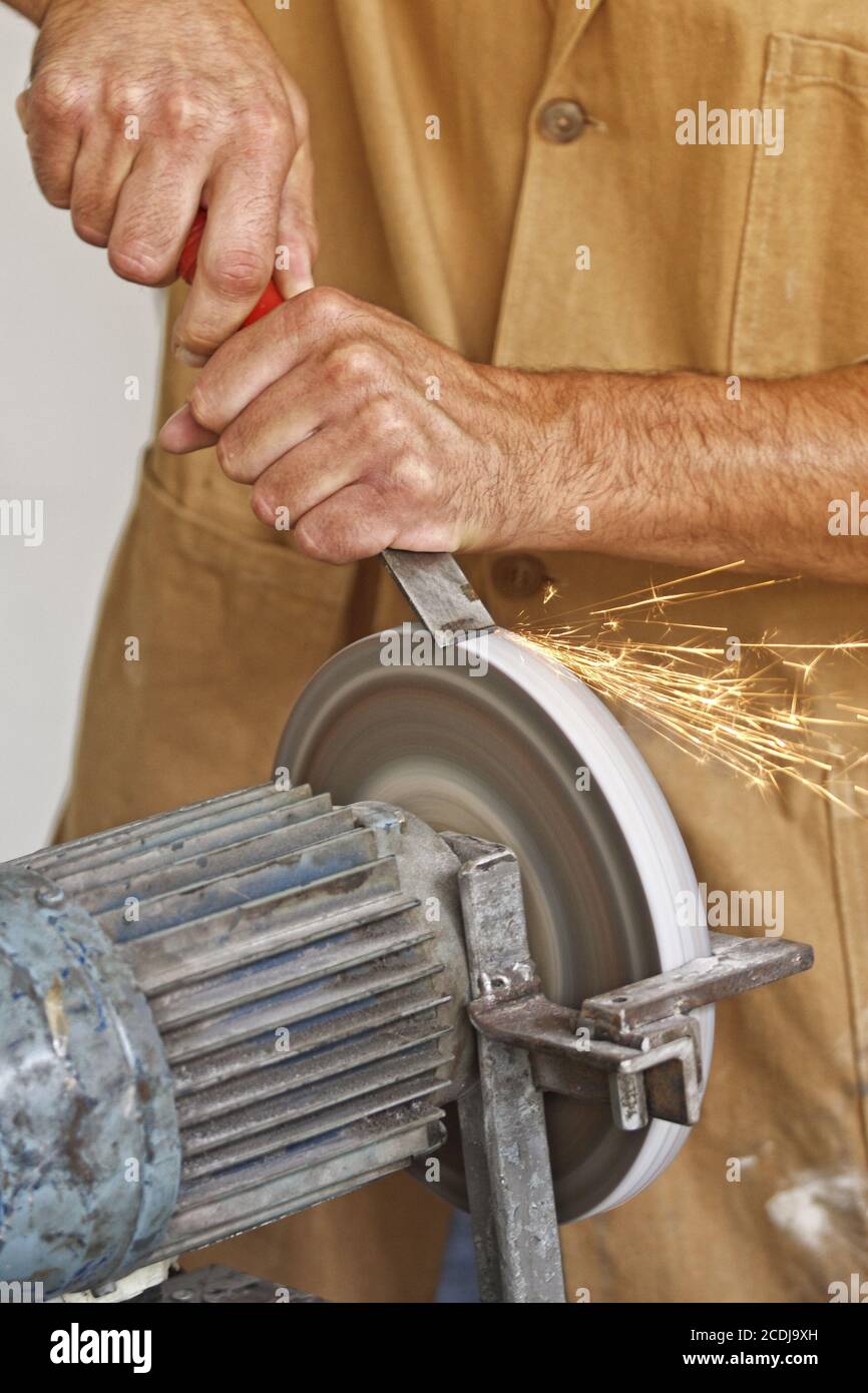 Grind grindstone hi-res stock photography and images - Alamy