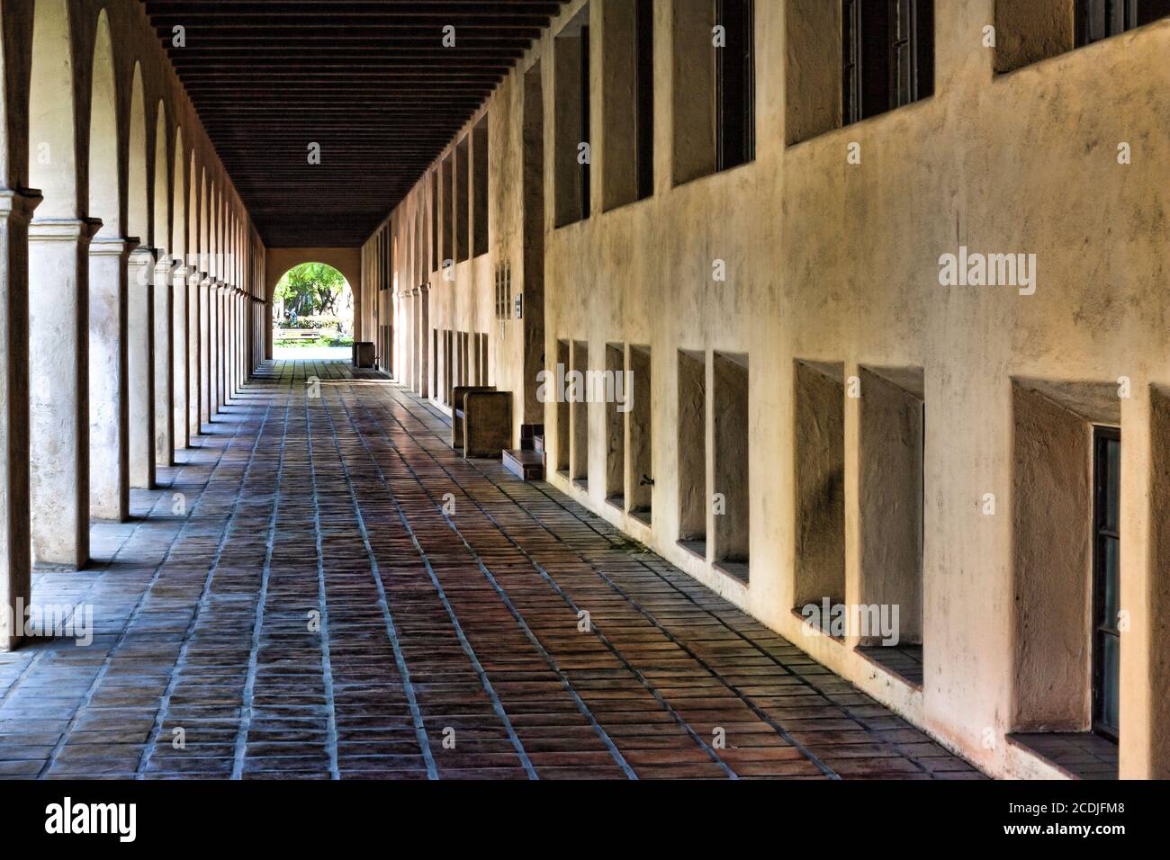 Long Exterior Hallway with Arched Entrance Stock Photo - Alamy