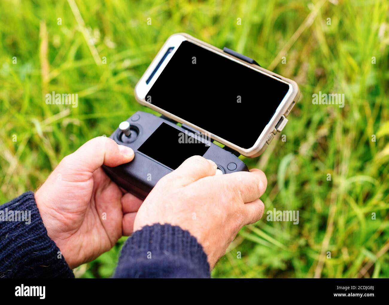 Person using a drone remote control hi-res stock photography and images ...