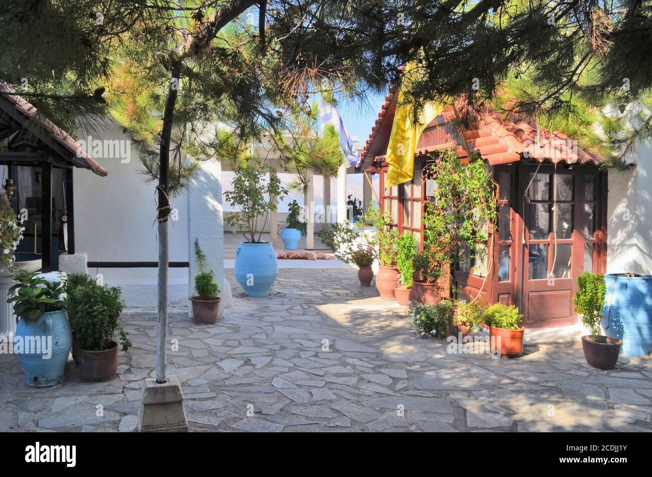 Standard Greek courtyard with flowers Stock Photo - Alamy