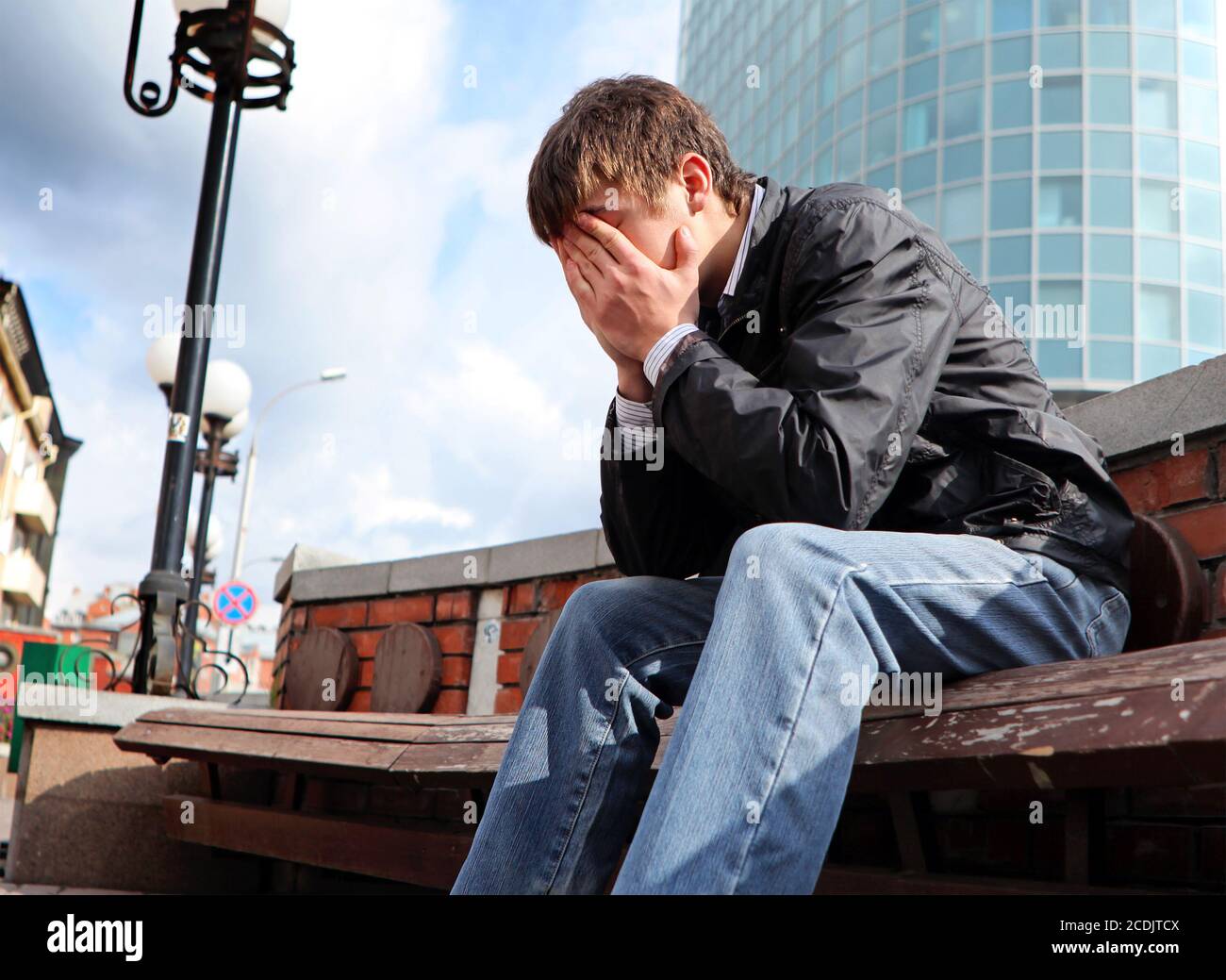 sad young man Stock Photo - Alamy