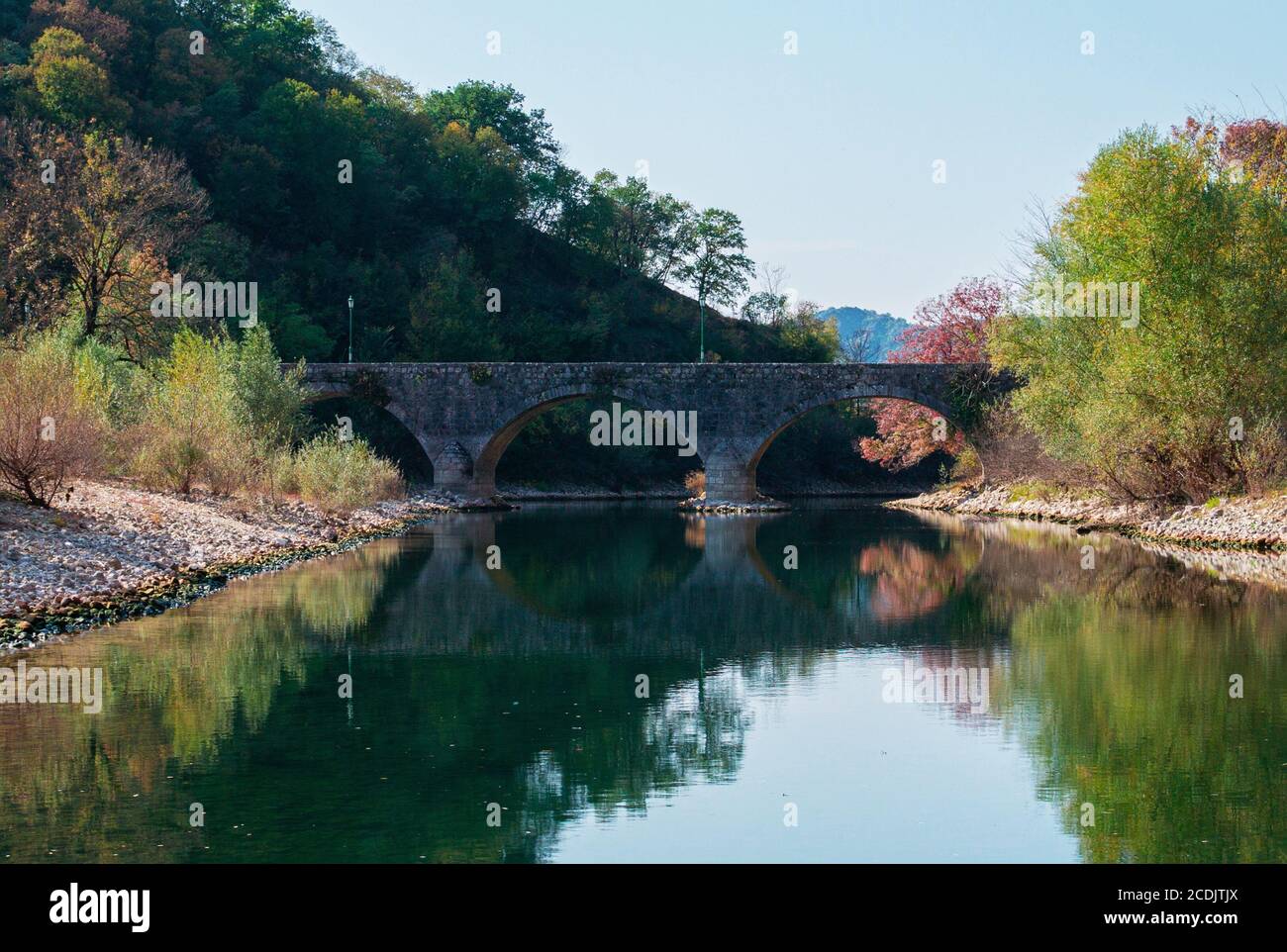 old stone arch bridge over river in Montenegro, landscape Stock Photo ...