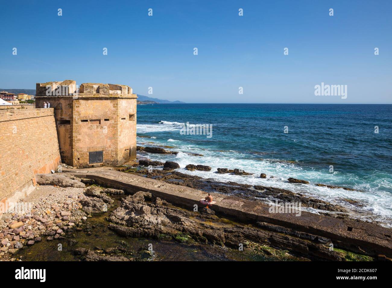 Italy, Sardinia, Alghero, View of walls and tower of the historical ...