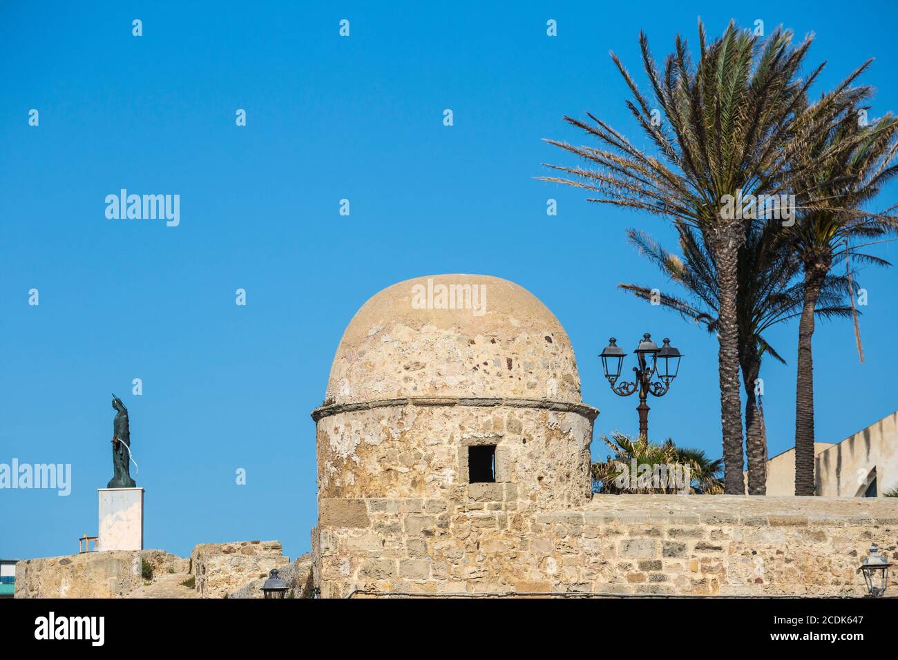 Italy, Sardinia, Alghero, Historical city walls and St Elmo statue ...