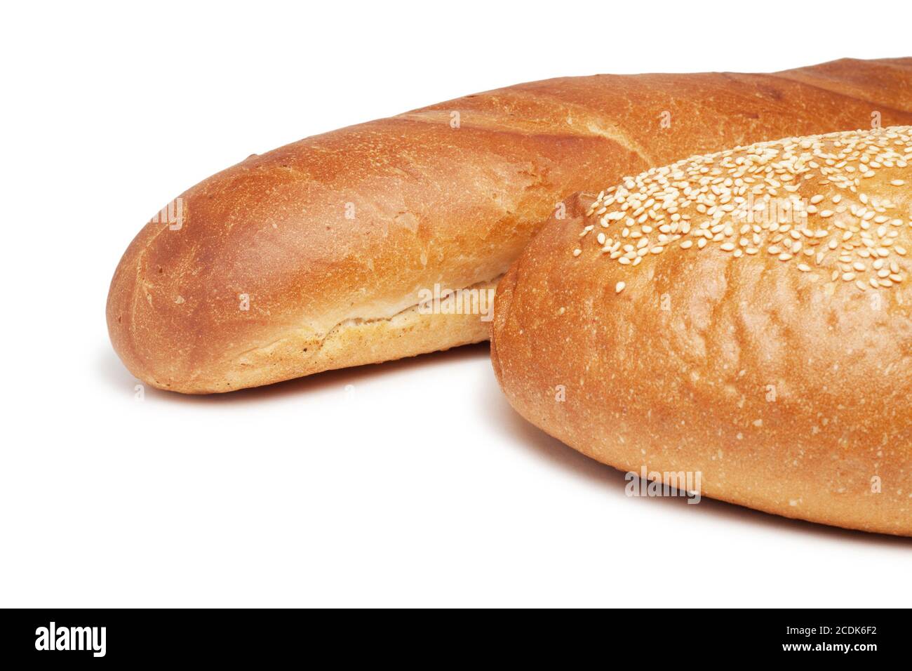 two loafs of bread isolated over white background Stock Photo - Alamy