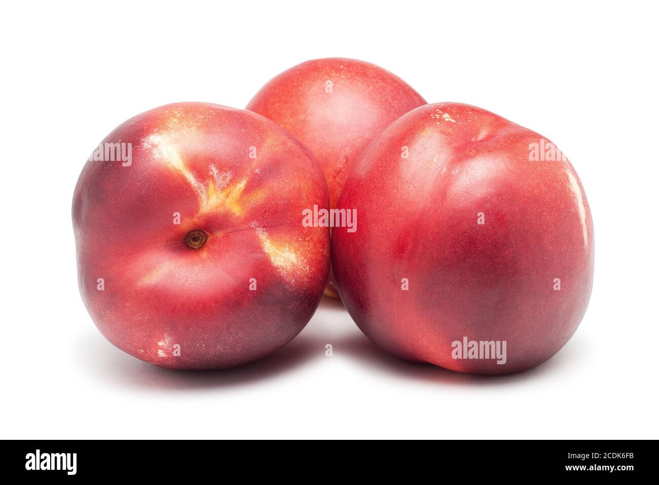 three ripe nectarines isolated on white background Stock Photo - Alamy