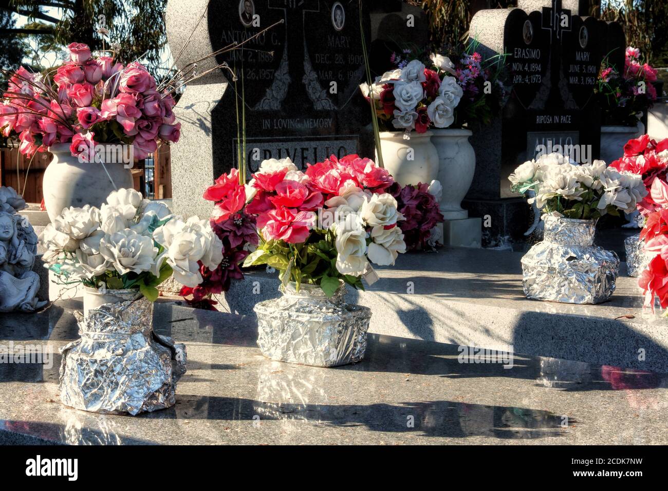 Flower Memorials at Cemetery Stock Photo - Alamy