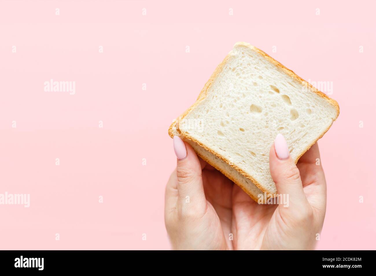 hand holding two slices of bread Stock Photo - Alamy