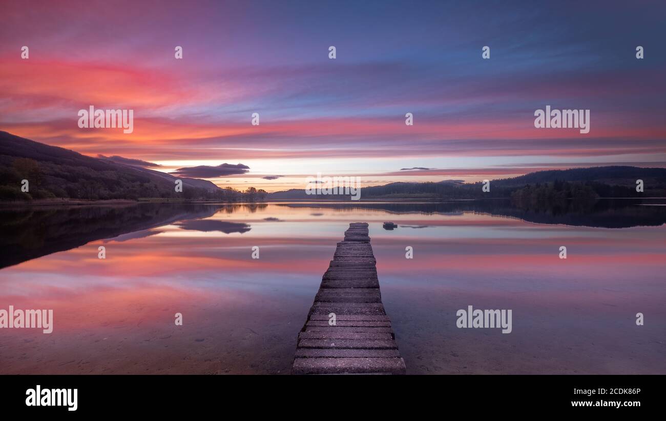 Purple Reflections of Dawn at Kinlochard Stock Photo - Alamy