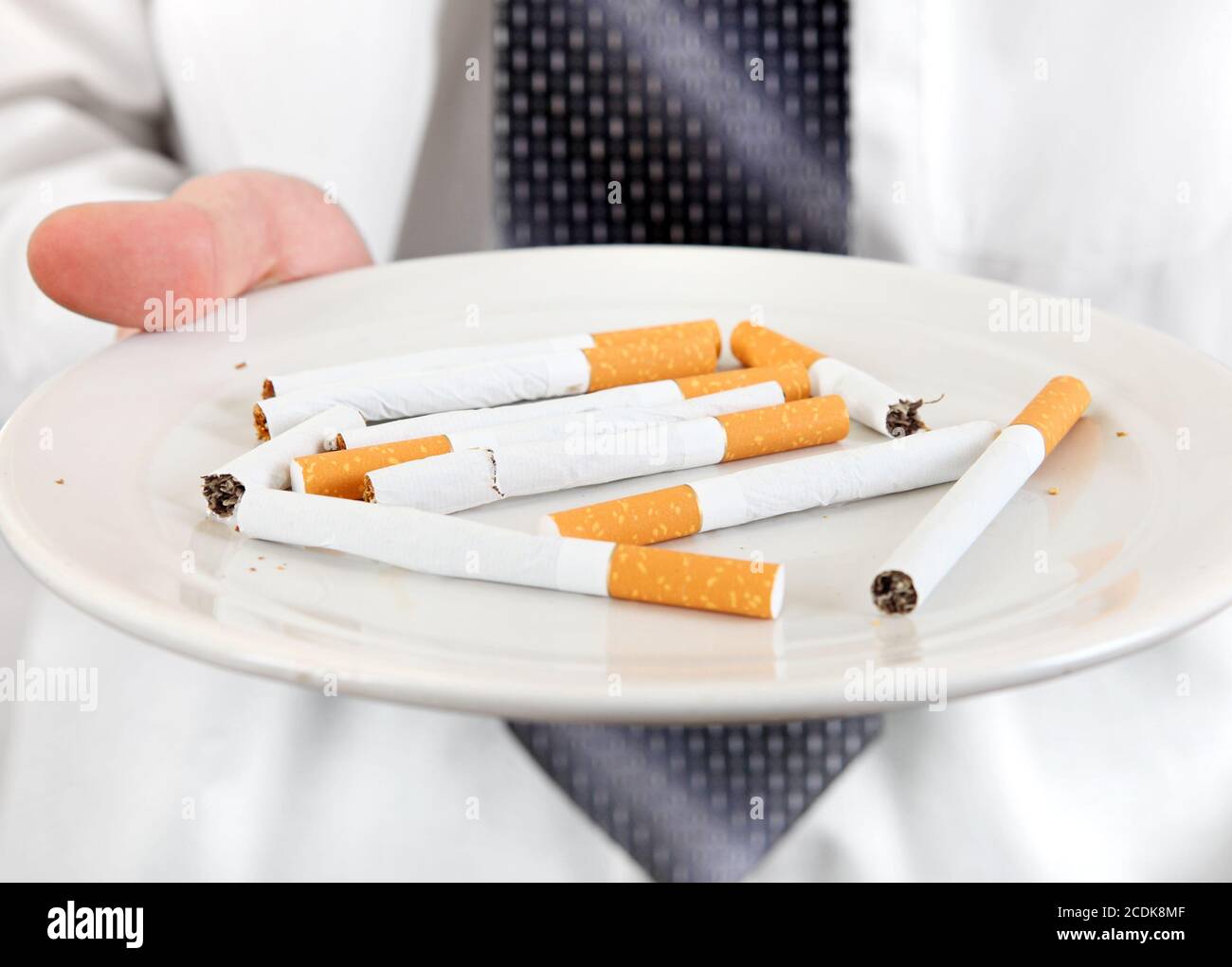 Plate With Cigarettes Stock Photo - Alamy