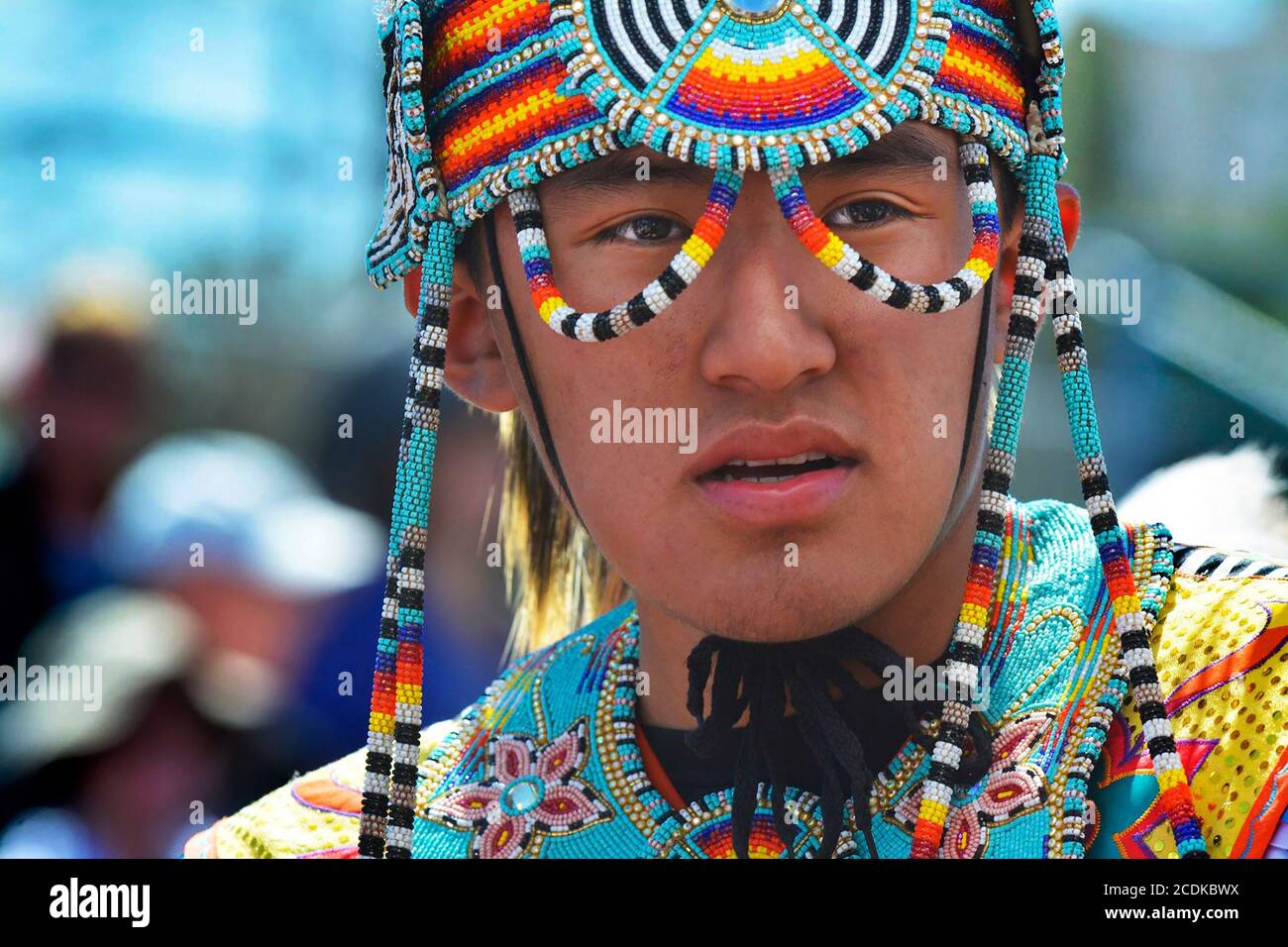 Close up portrait of young Native American male dancer in colorful ...