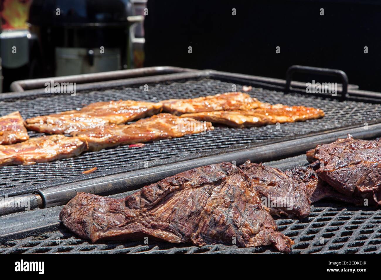 Chicken and Beef on Grill Stock Photo - Alamy