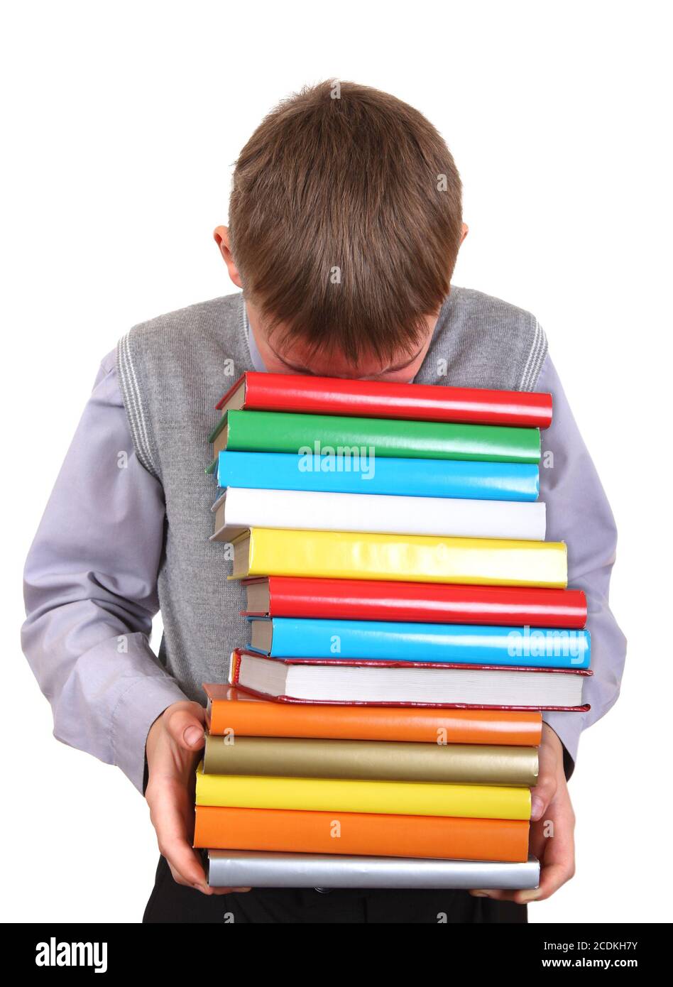 Boy holding school books hi-res stock photography and images - Alamy